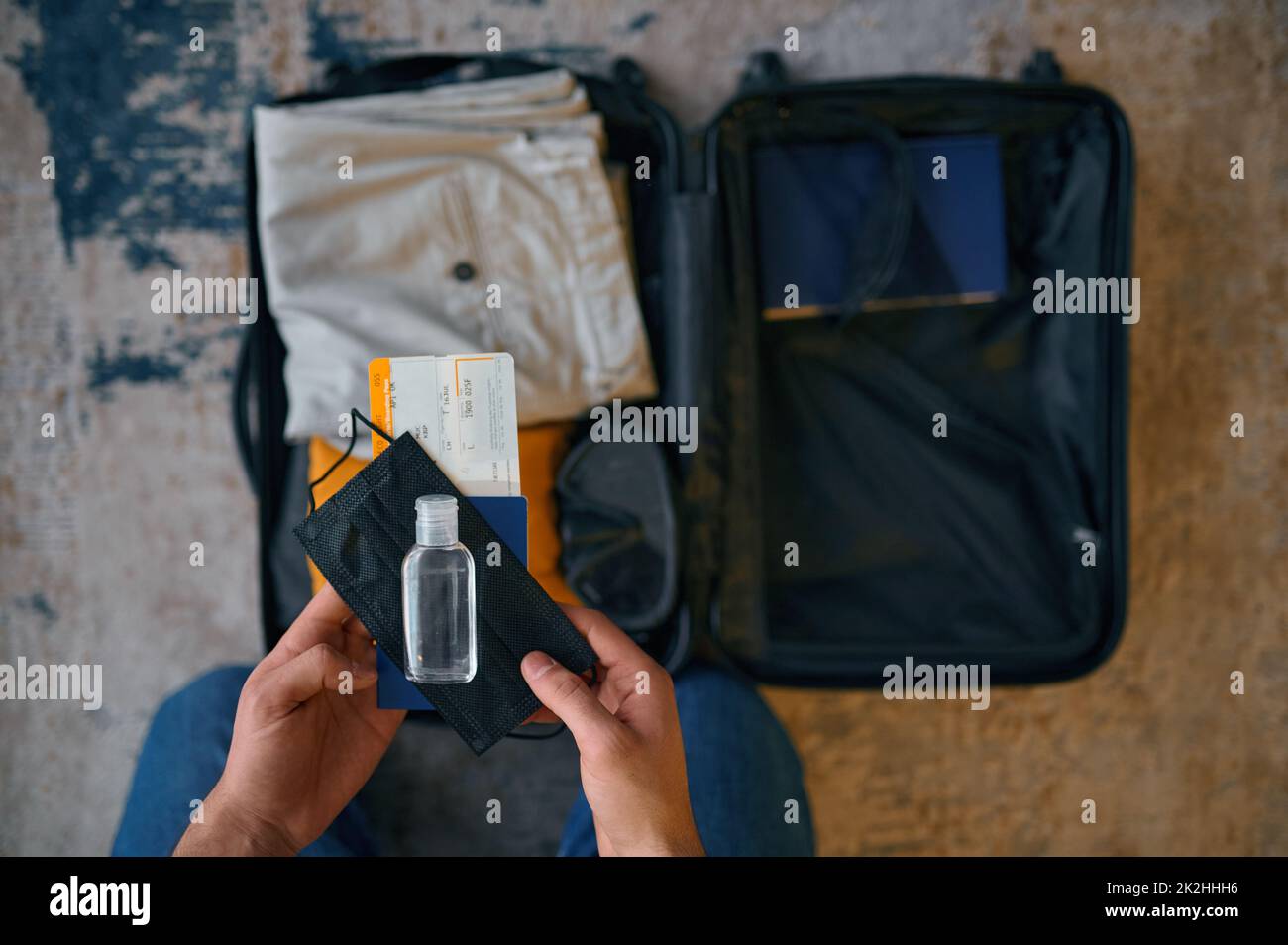 Preparing suitcase for travel during coronavirus pandemic Stock Photo ...