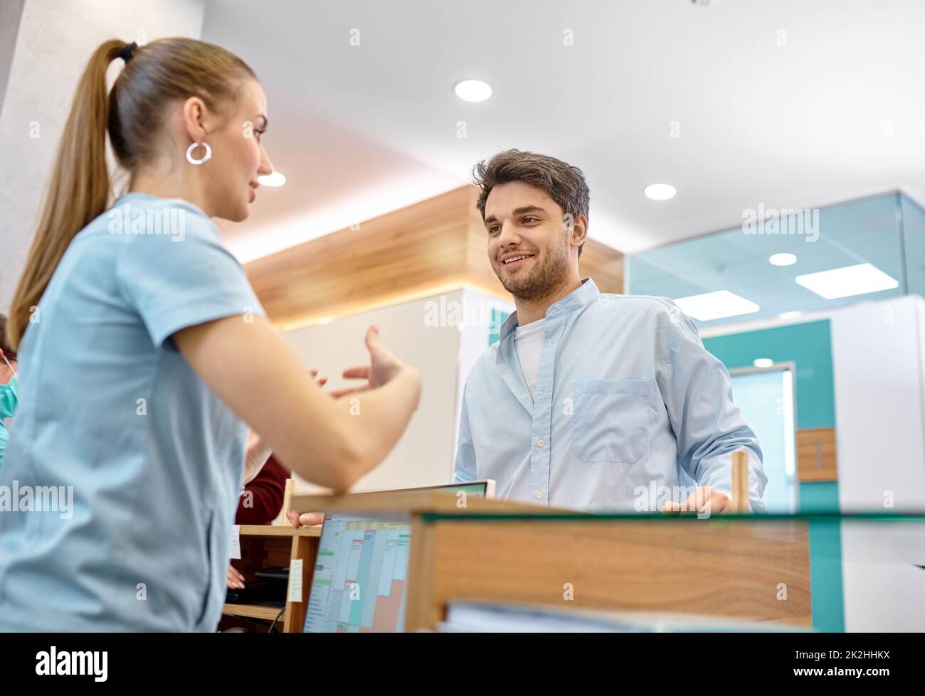 Male receptionist at desk hi-res stock photography and images - Alamy