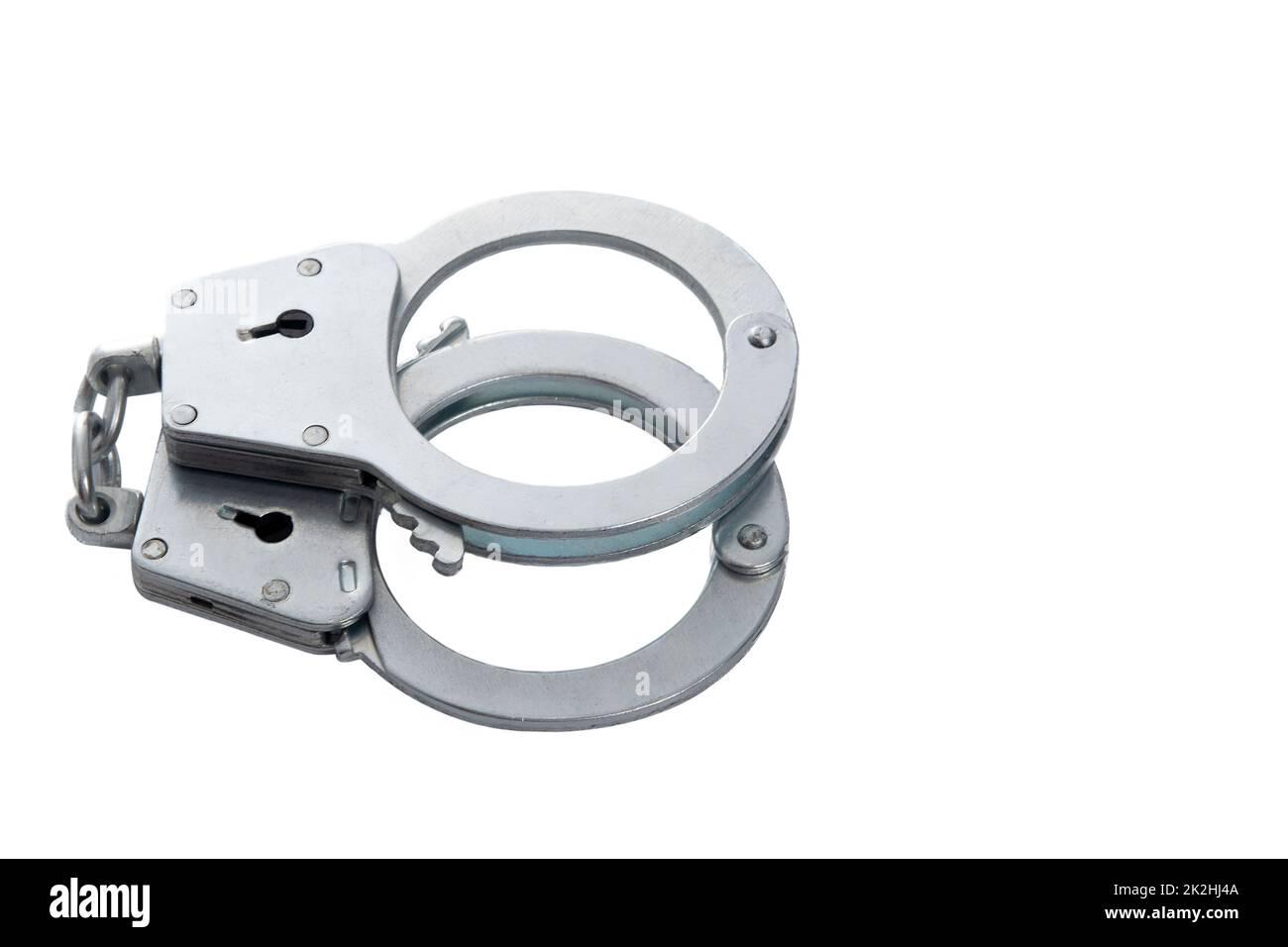 Silver handcuffs Cut Out Stock Images & Pictures - Alamy