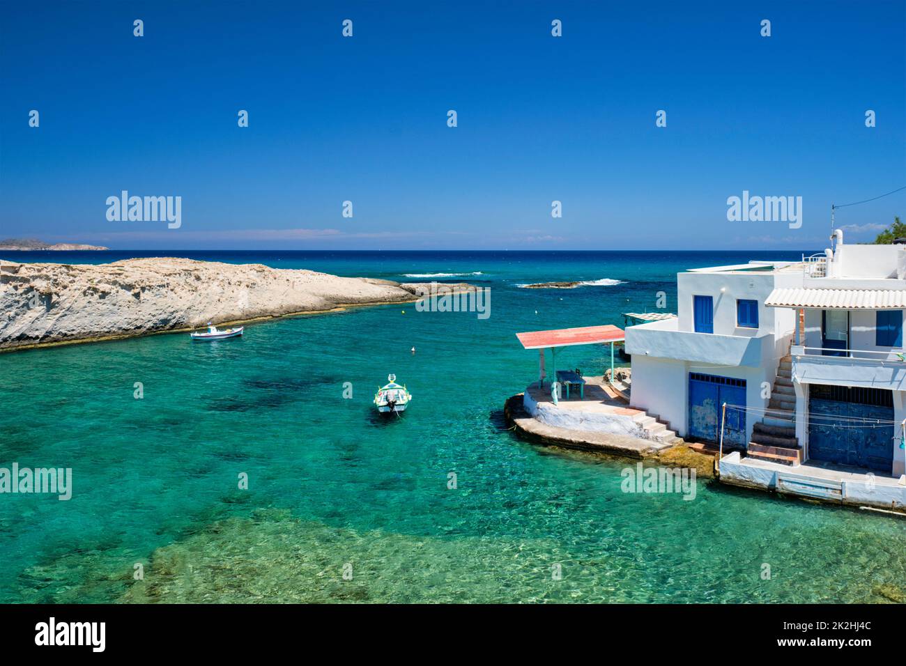 Greece island Milos. Small harbor with fishing boats in water ...