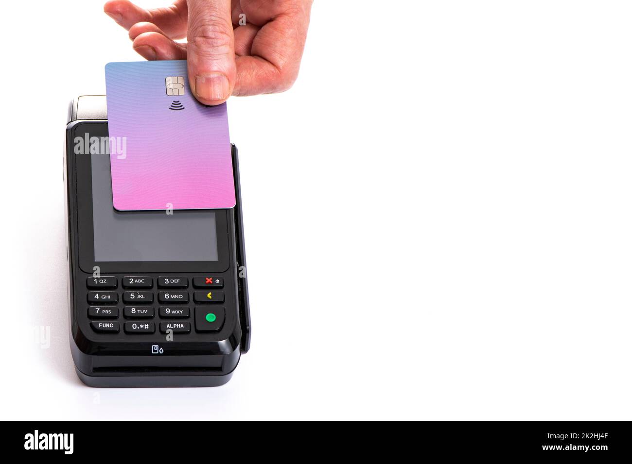 Attached plastic card to the payment terminal with a man's hand on a ...