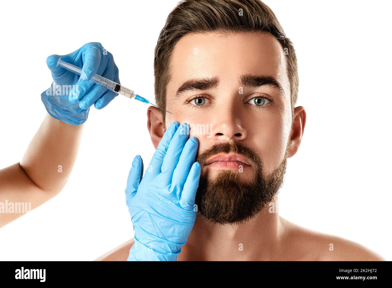 Handsome man receiving facial injection for skin rejuvenation Stock ...