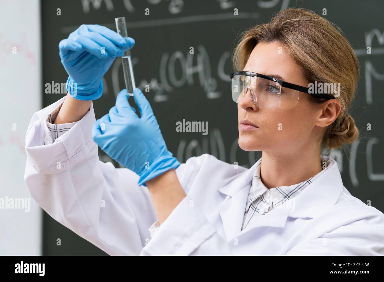 Scientist inspecting substance inside the test tube in a laborat Stock ...