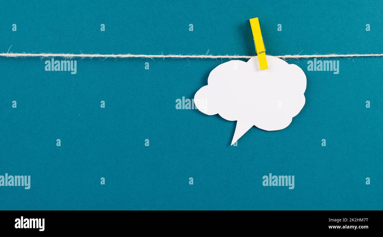 White cloud hanging on a line, empty copy space for text, blue ...