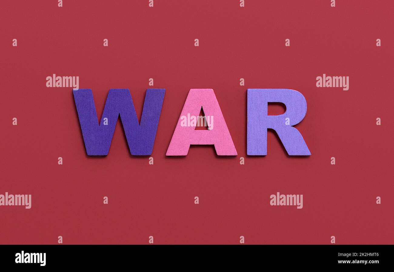 WAR, word written in colorful wooden alphabet letters on red background ...