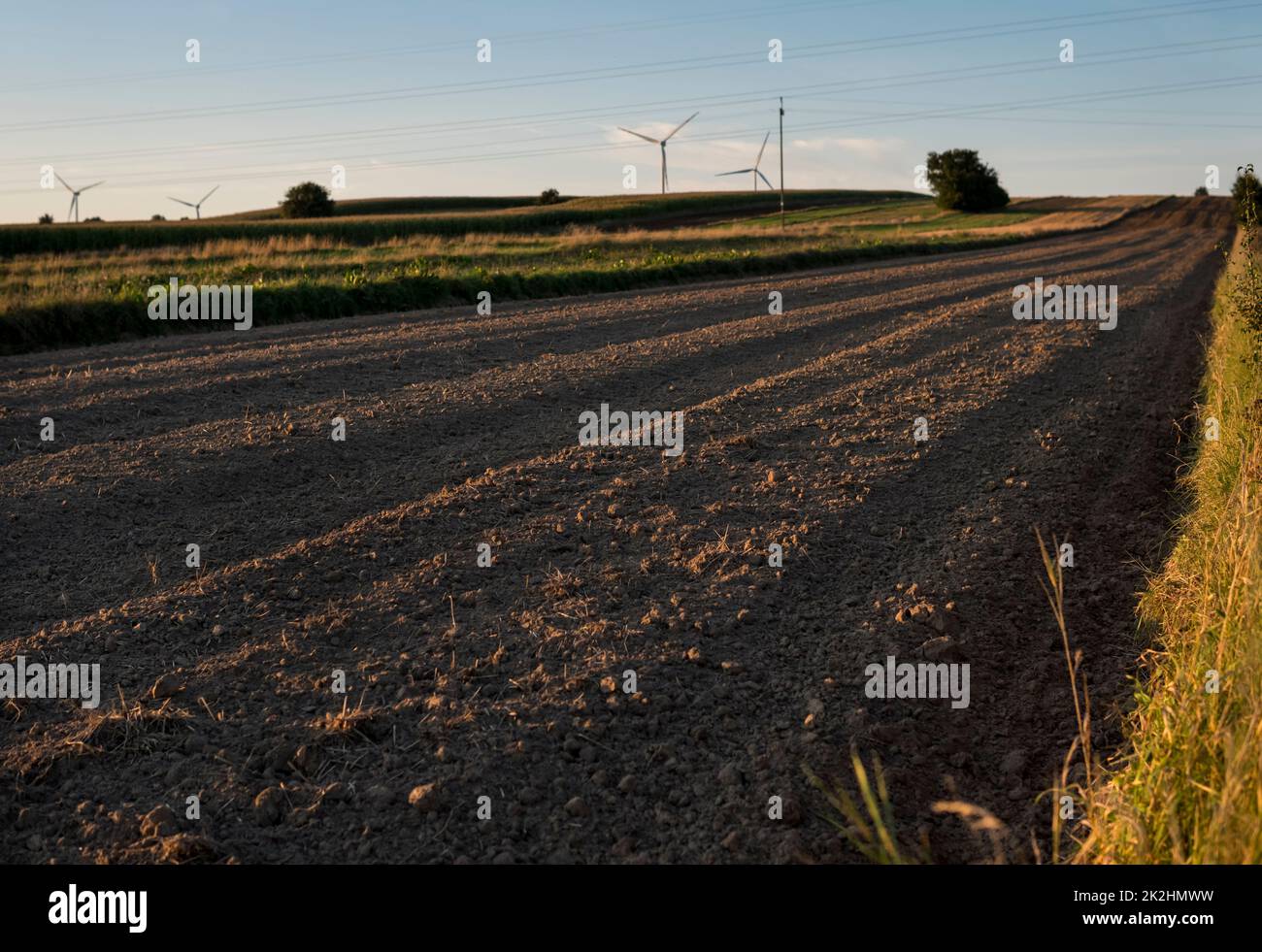 rural landscape with empty fields and wind turbines Stock Photo - Alamy