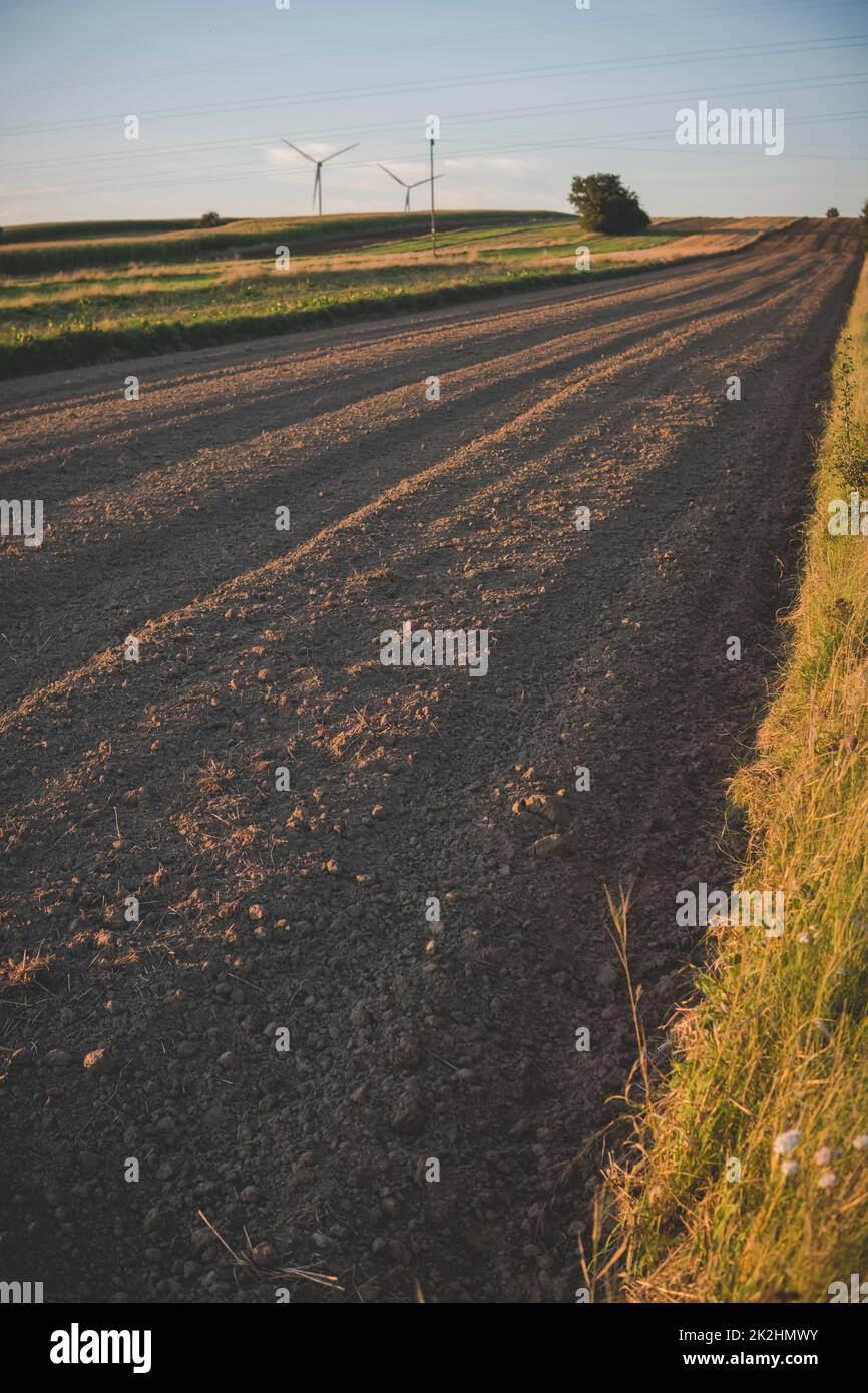 rural landscape with empty fields and wind turbines Stock Photo - Alamy