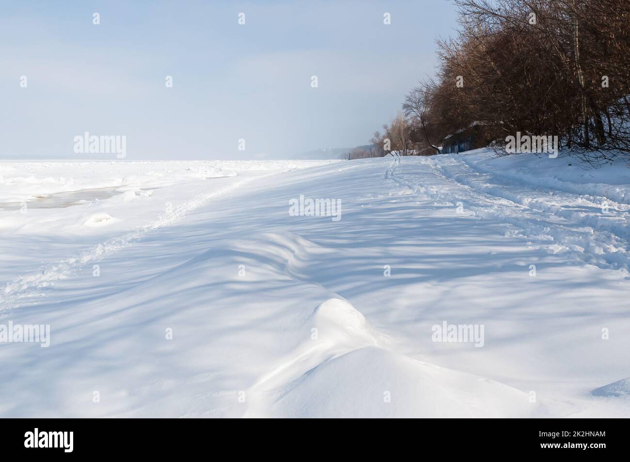 Stunning view of the frozen river covered with chunks of ice and white ...