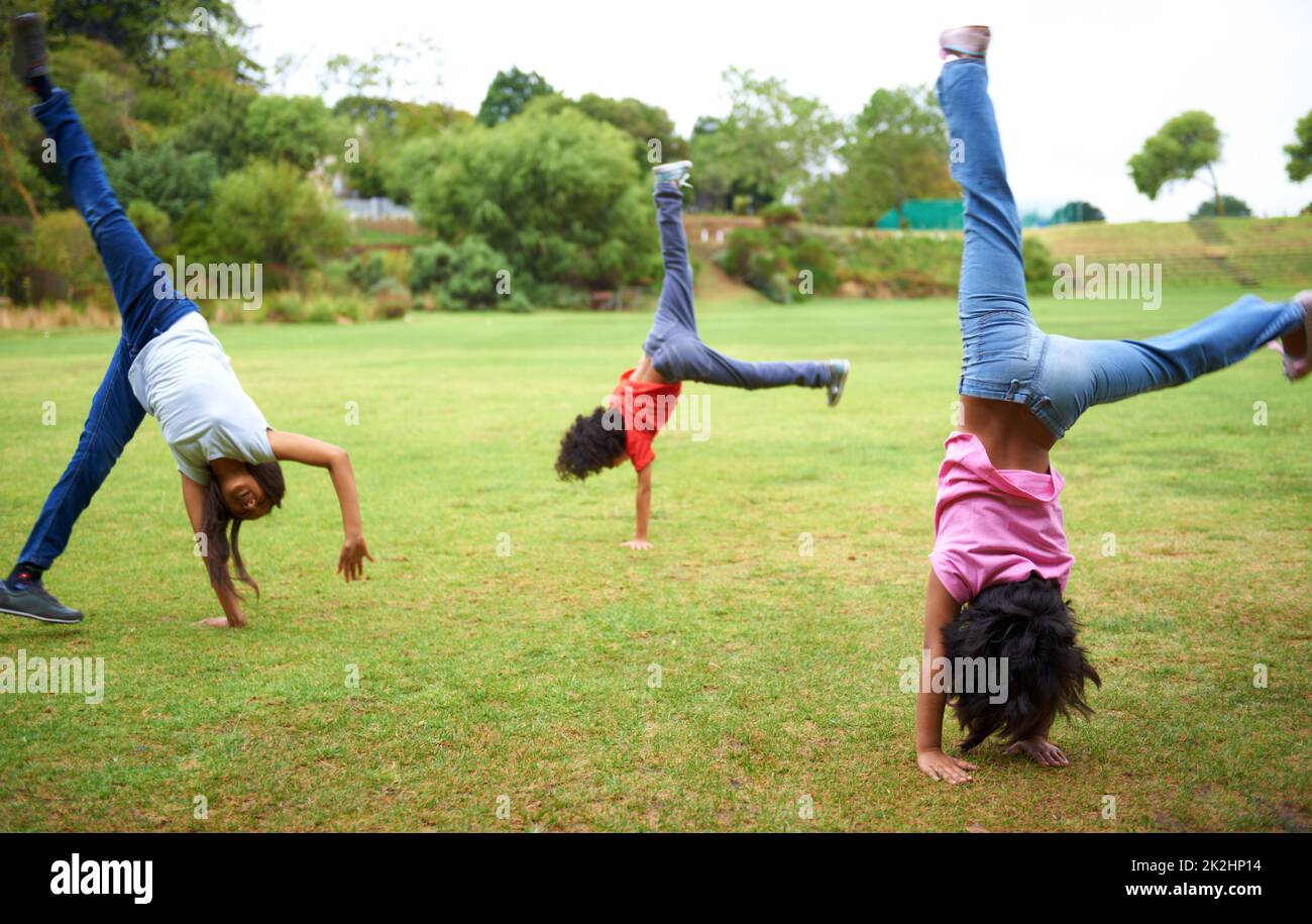 Handstands in park hi-res stock photography and images - Alamy