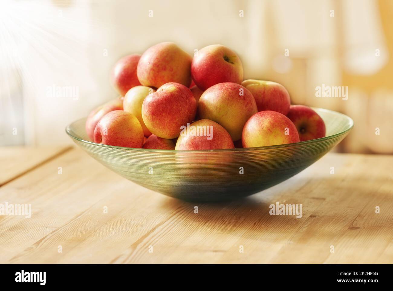 An apple per day keeps the doctor away. Glass bowl with lots of healthy ...