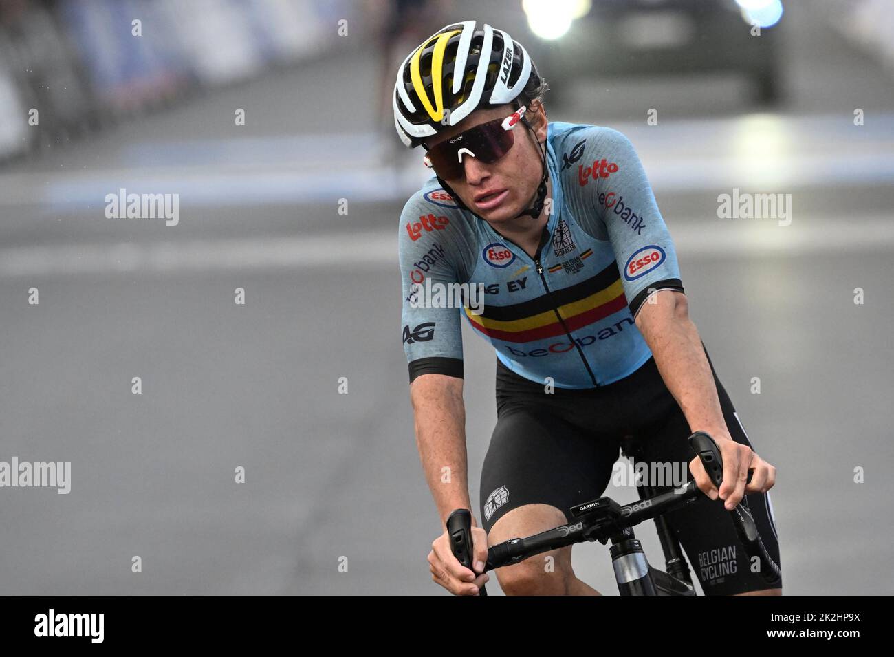 Belgian Lennert Van Eetvelt crosses the finish line of the U23 men road ...
