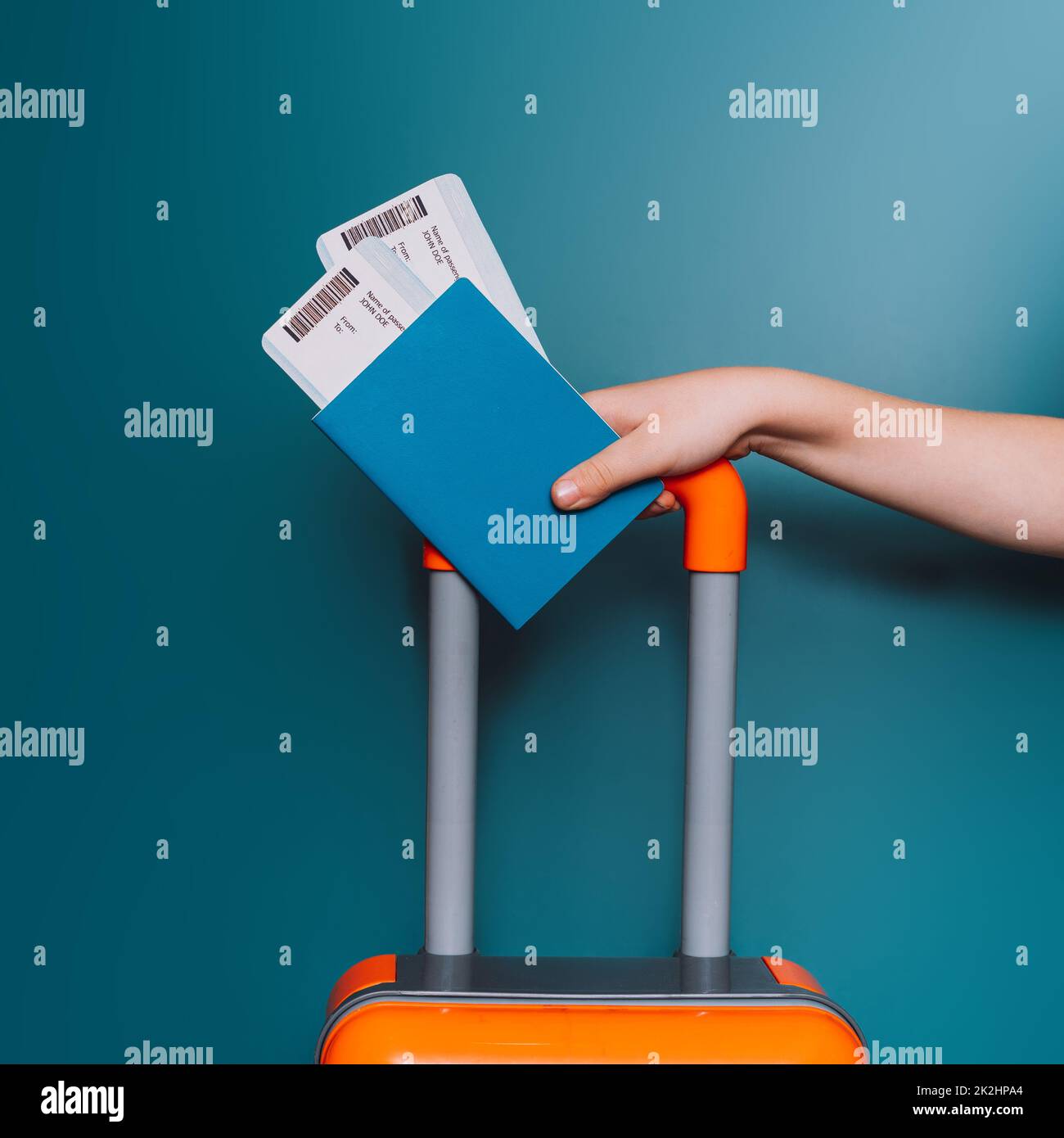 Two tickets in the passport on luggage against blue background Stock ...