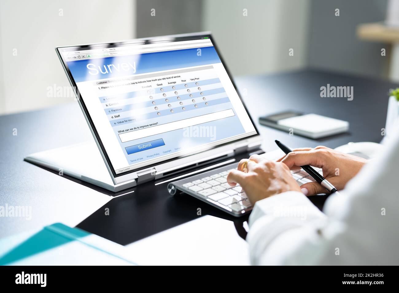 Woman Filling Survey Poll Or Form On Laptop Computer Stock Photo - Alamy