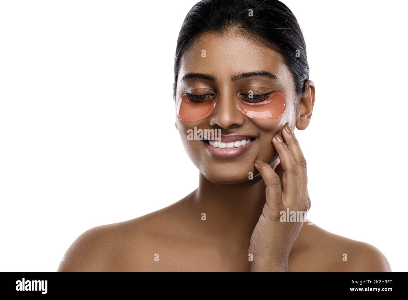 Beautiful Indian woman with hydrating eye patches under her eyes Stock ...