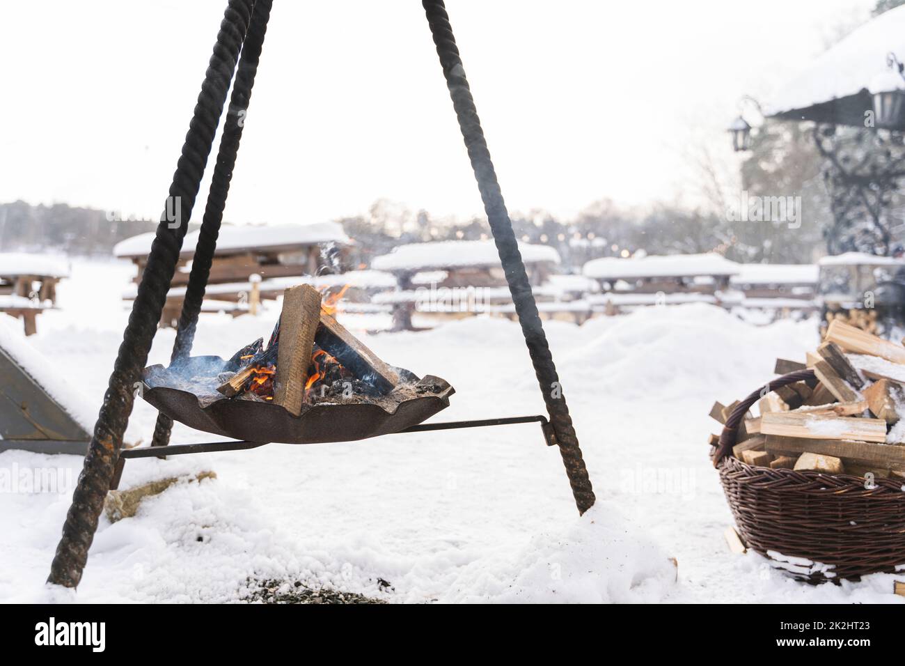 Firewood burning inside the fire-pit during cold winter day Stock Photo ...