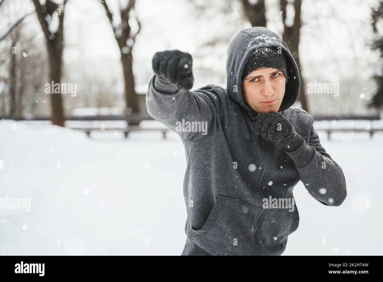 Fighter boxing during his winter workout in snowy park Stock Photo - Alamy