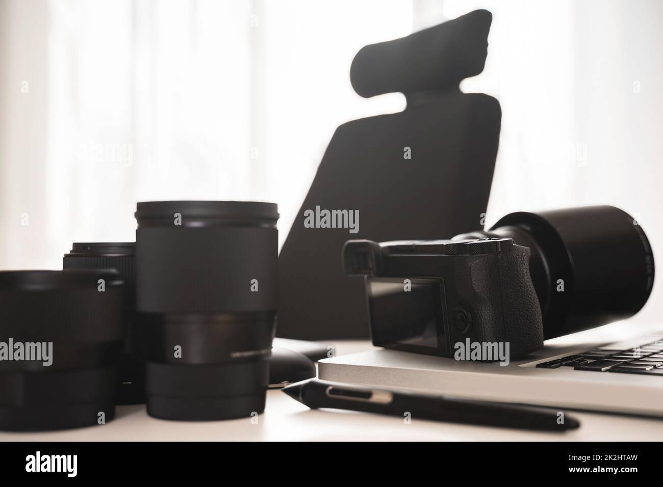 Workplace with a modern equipment for photography. Mirrorless camera ...