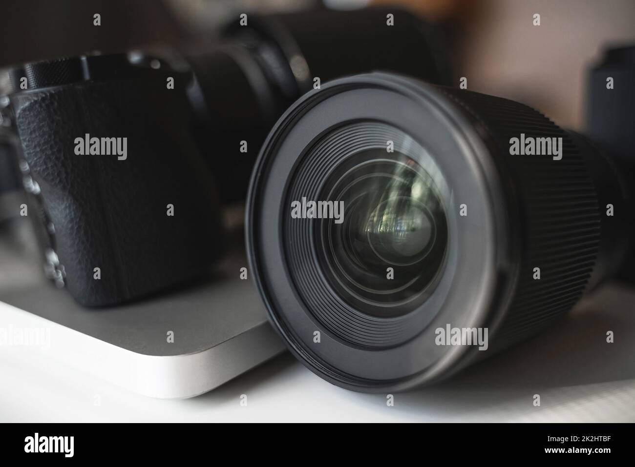 Modern mirroless camera and prime lense Stock Photo - Alamy