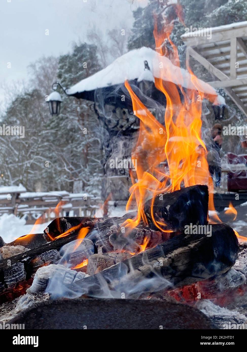Firewood burning inside the fire-pit during cold winter day Stock Photo ...