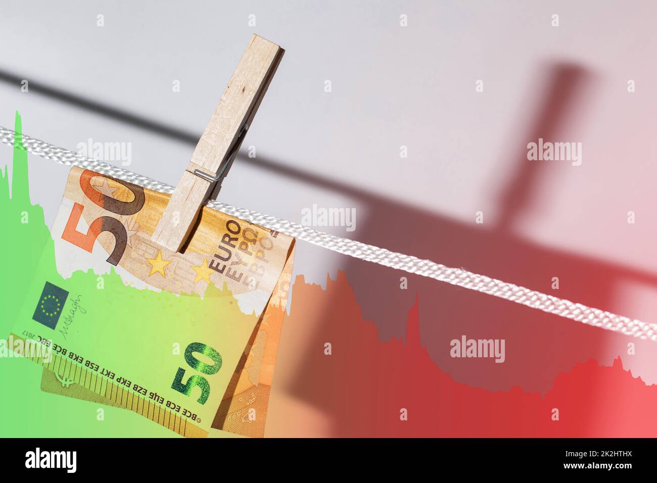 Euro banknote and falling diagram chart Stock Photo - Alamy