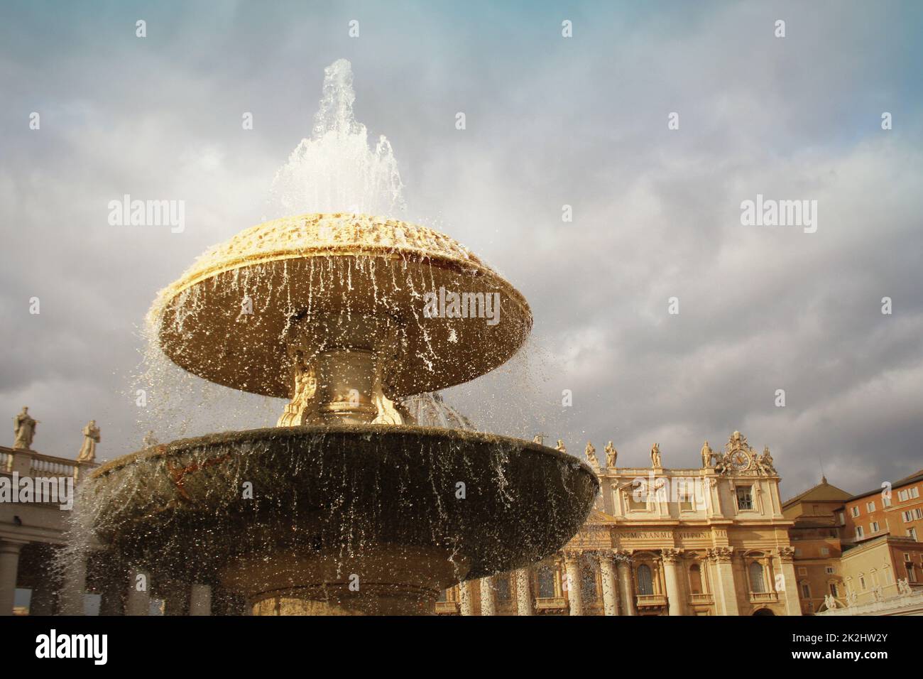 fountain in front of the main facade of the Basilica of St. Peter ...