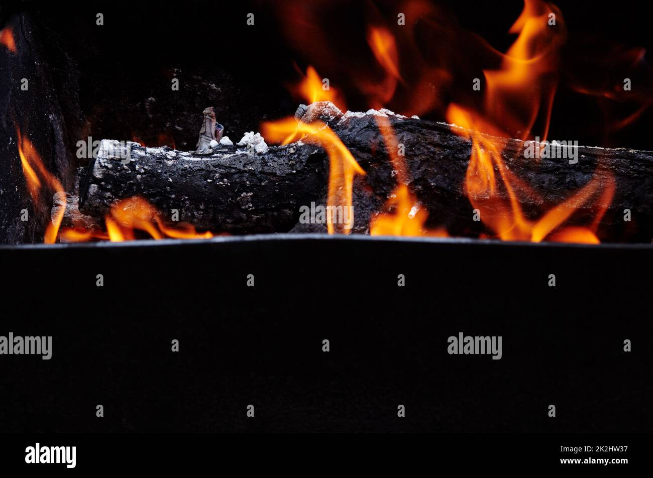 Burning red hot sparks fly from fire. Barbecue gril with glowing and ...