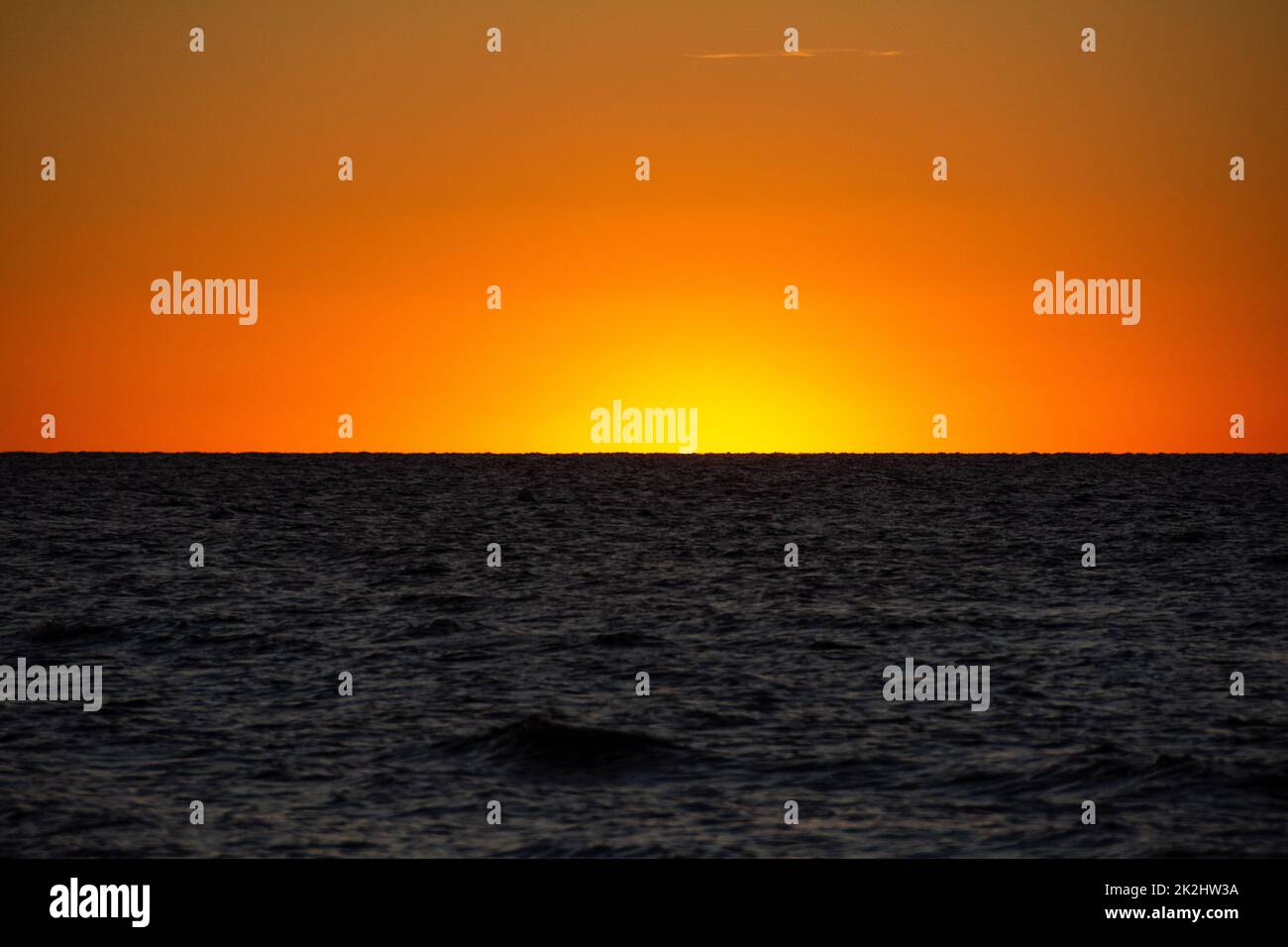 Light on the horizon over the sea after sunset Stock Photo - Alamy