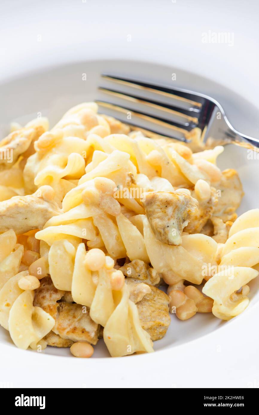 pasta fusilli with chicken meat and white beans Stock Photo - Alamy