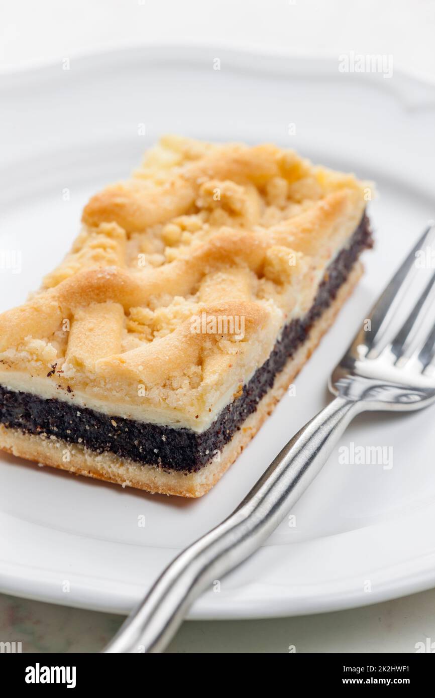 a piece of poppy cake with crumble Stock Photo - Alamy