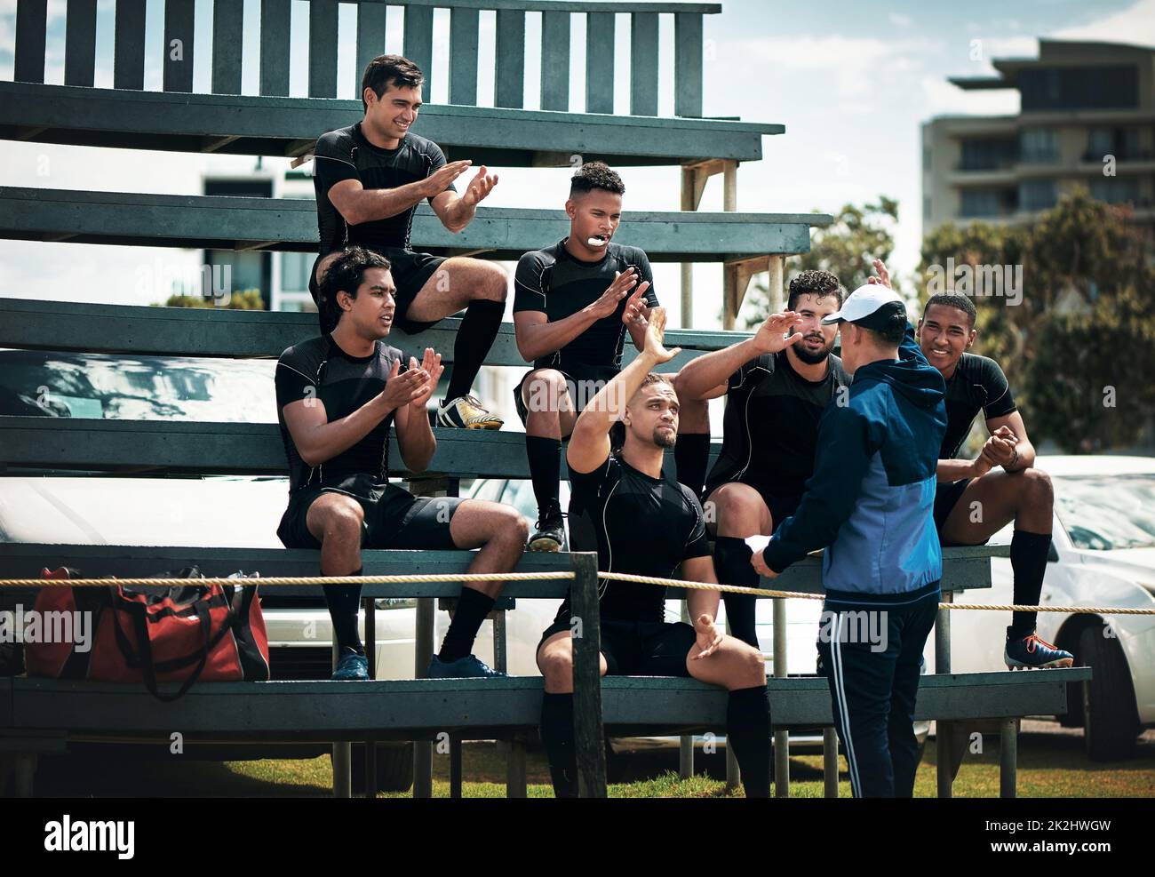You've done it once again. Cropped shot of a team of rugby players ...