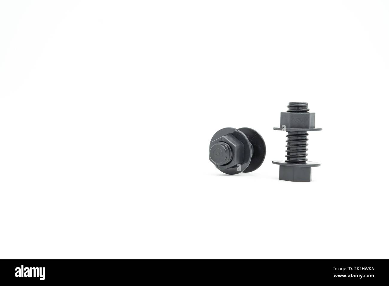 Children's plastic toy black nut bolt on a white background Stock Photo ...