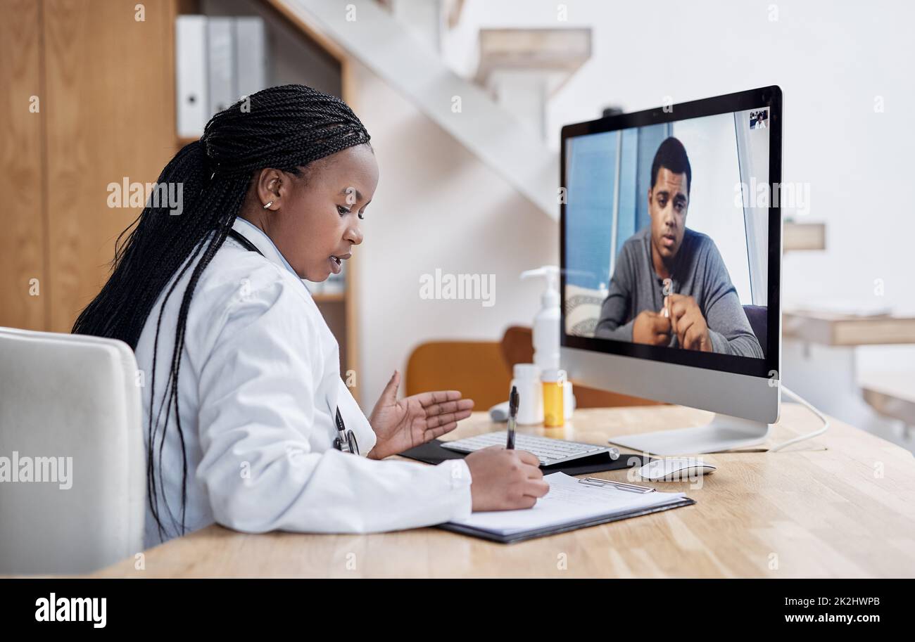 Doctor taking video appointment hi-res stock photography and images - Alamy