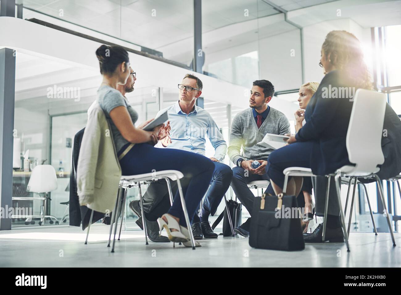 Coworkers talking in a circle hi-res stock photography and images - Alamy