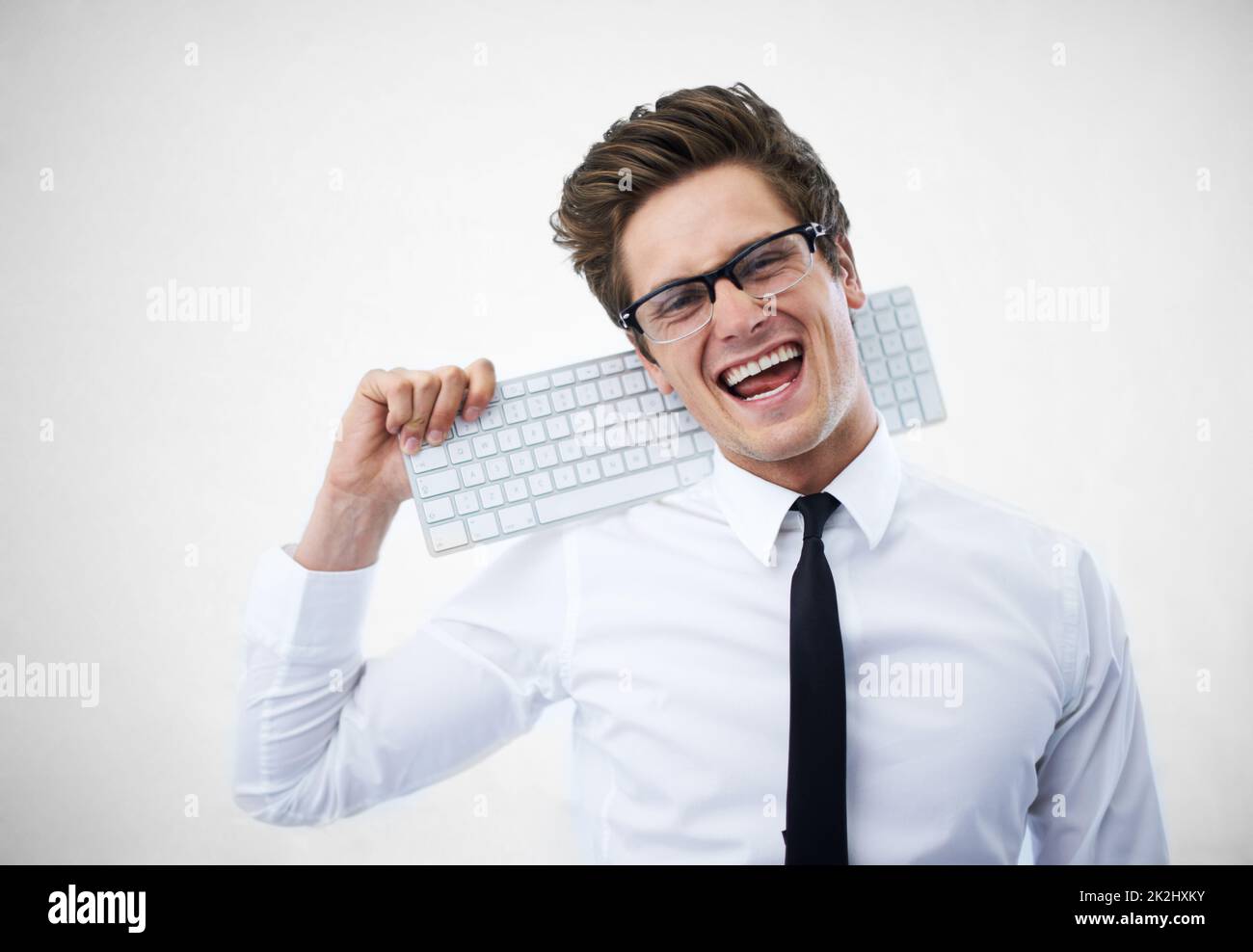 Up to date with all technology. A young nerdy guy resting his keyboard ...
