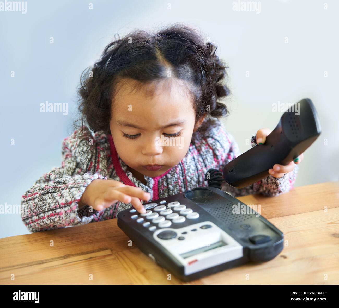 Learning as she grows. Shot of a cute little girl at home Stock Photo ...
