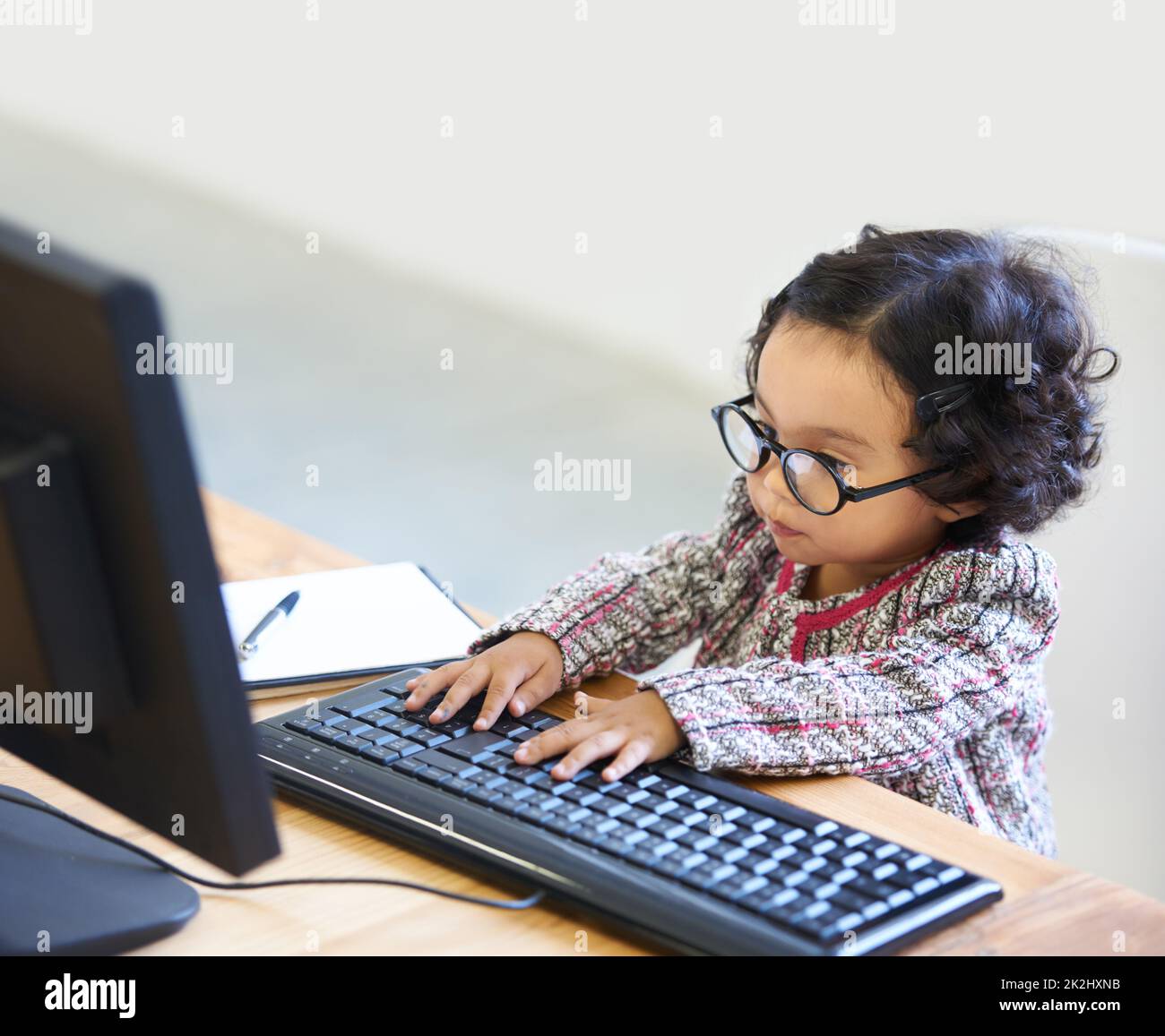 Learning as she grows. Shot of a cute little girl at home Stock Photo ...