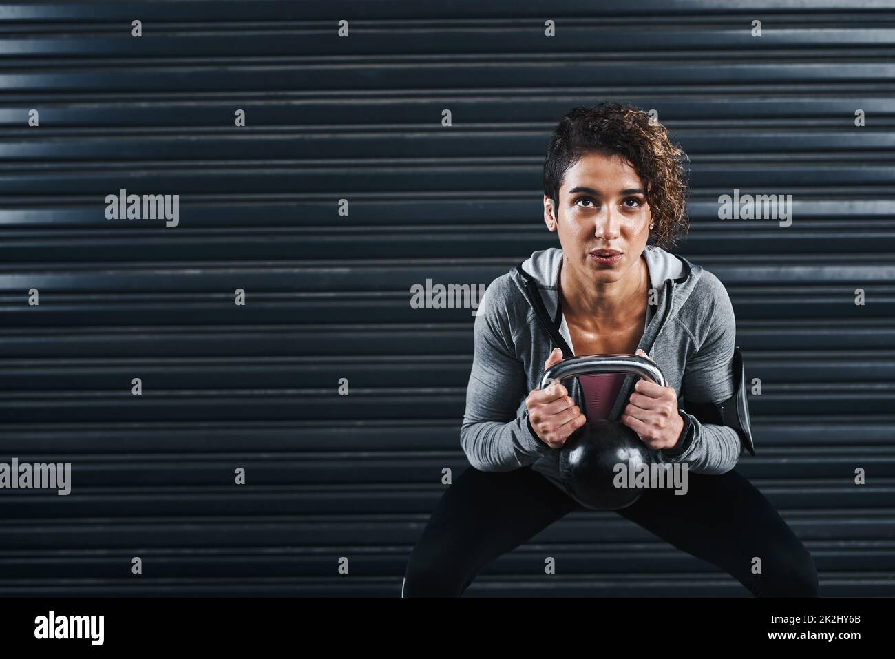 No pain no gain. Full length shot of an attractive young woman ...