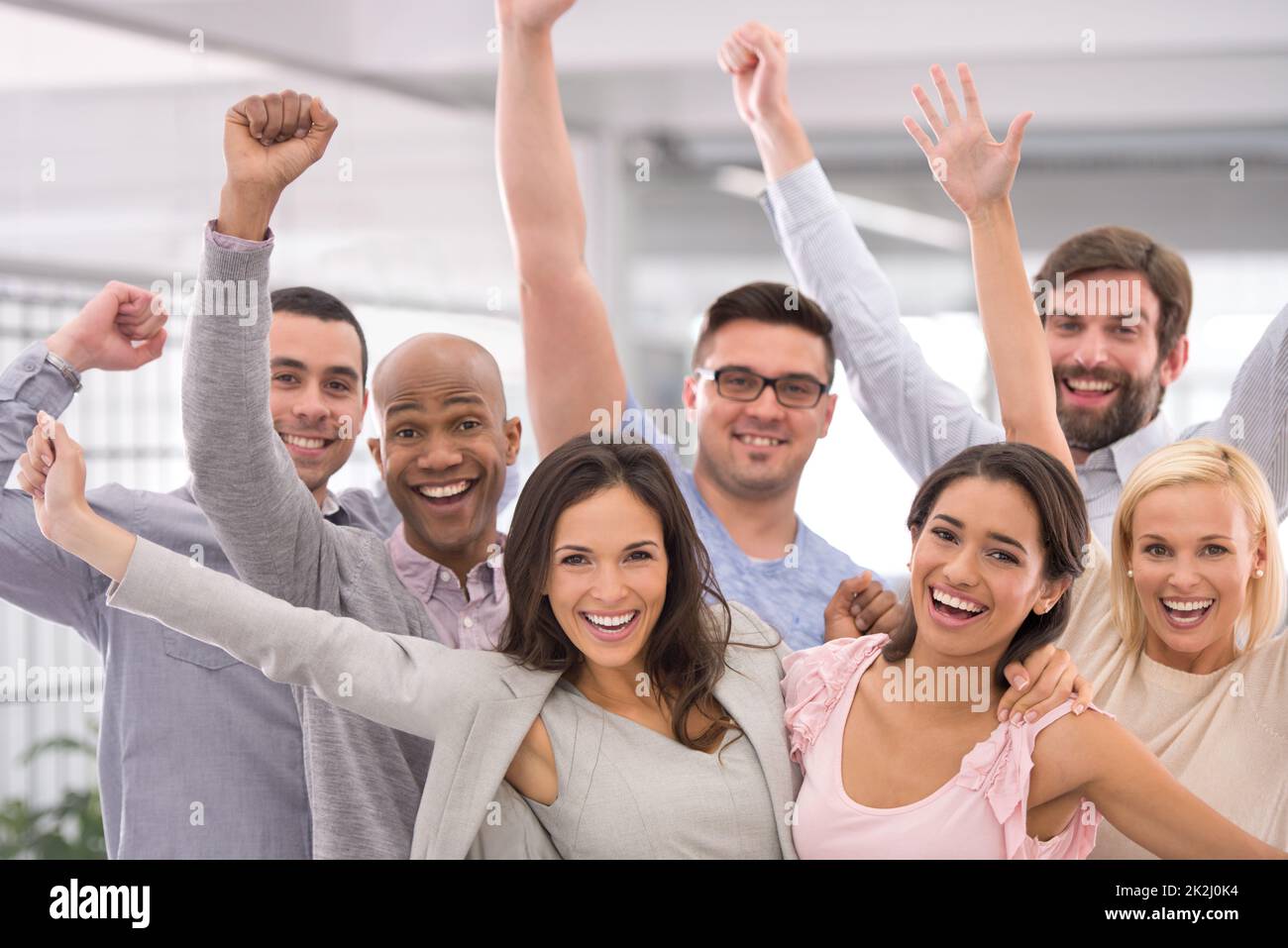 Three cheers for business success. Cropped shot of a group of ...