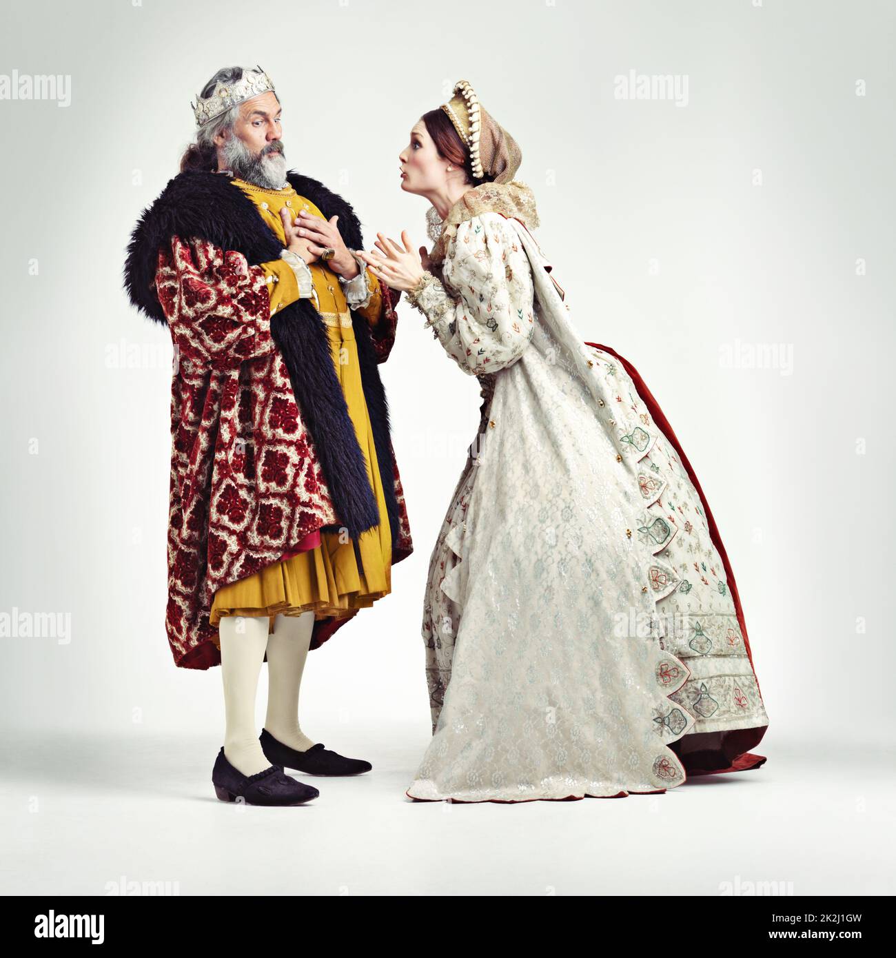 The Queen gets what she wants. Studio shot of a king and queen arguing ...