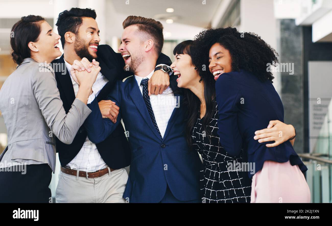 Team hugging hi-res stock photography and images - Alamy