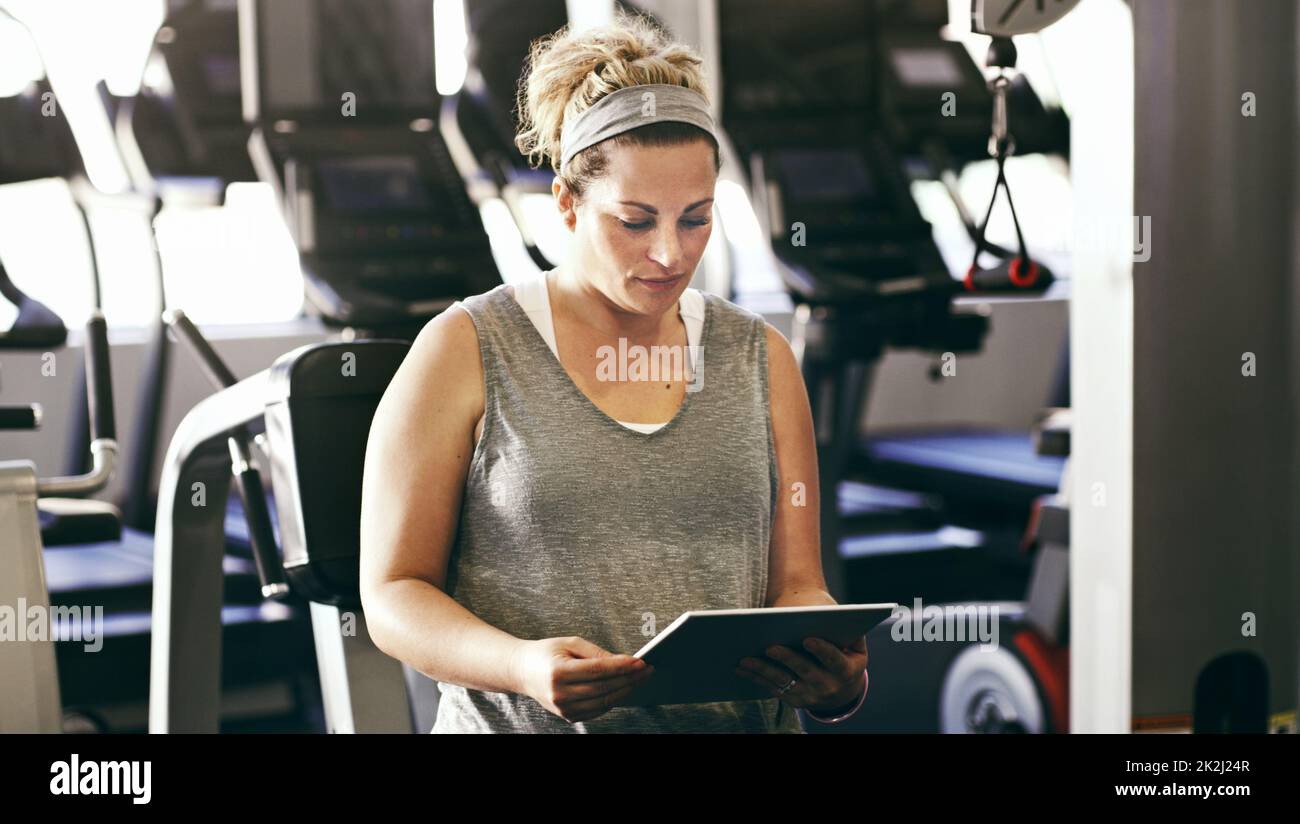 Tracking her progress with a fitness app Stock Photo - Alamy