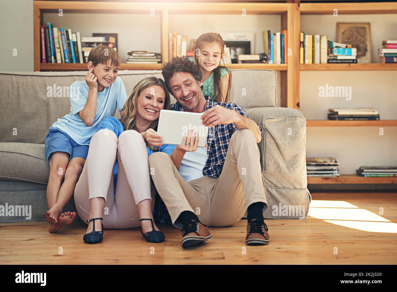 Happy family with digital tablet hi-res stock photography and images ...