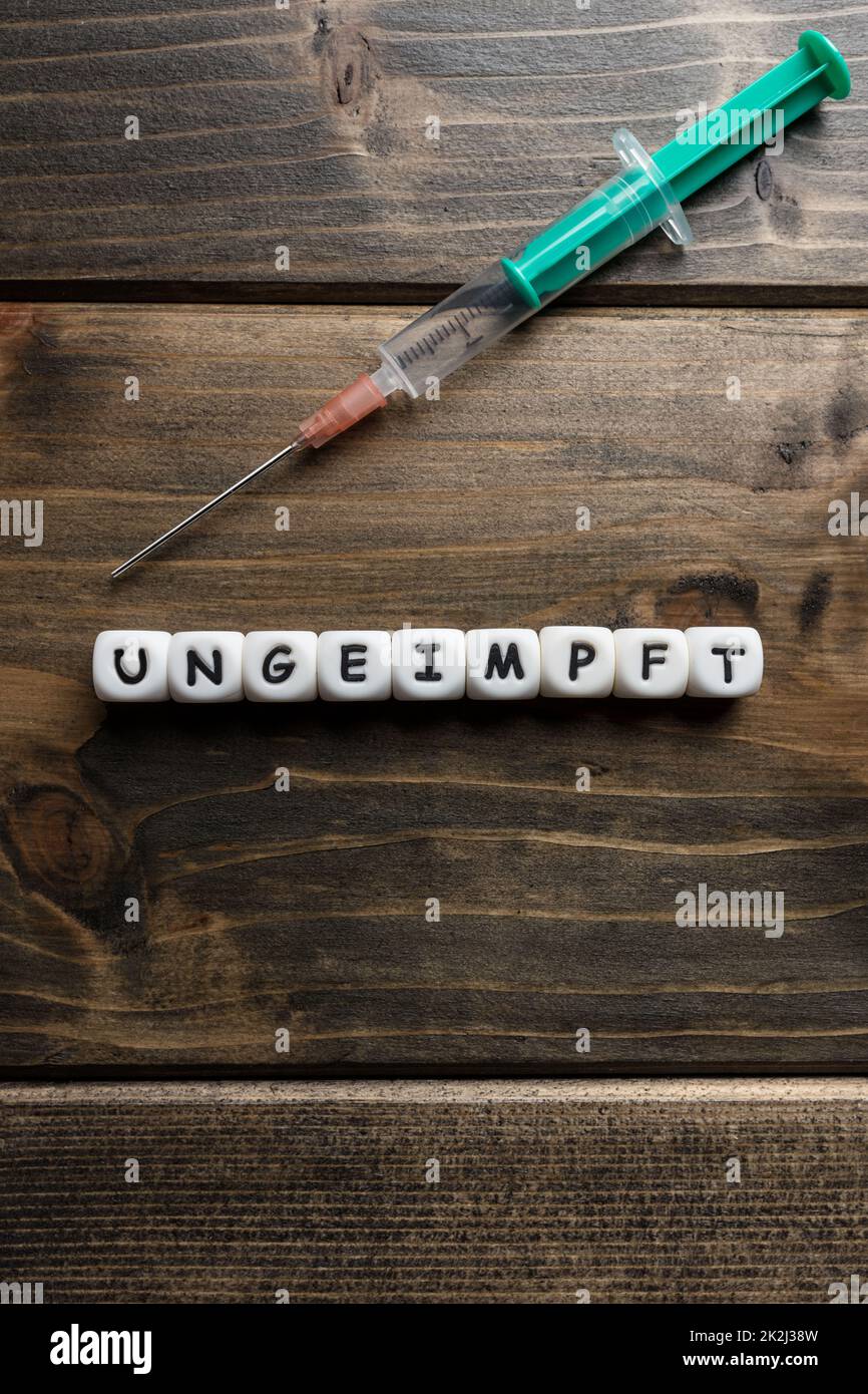 Corona virus Covid-19 vaccine text background in German Stock Photo - Alamy