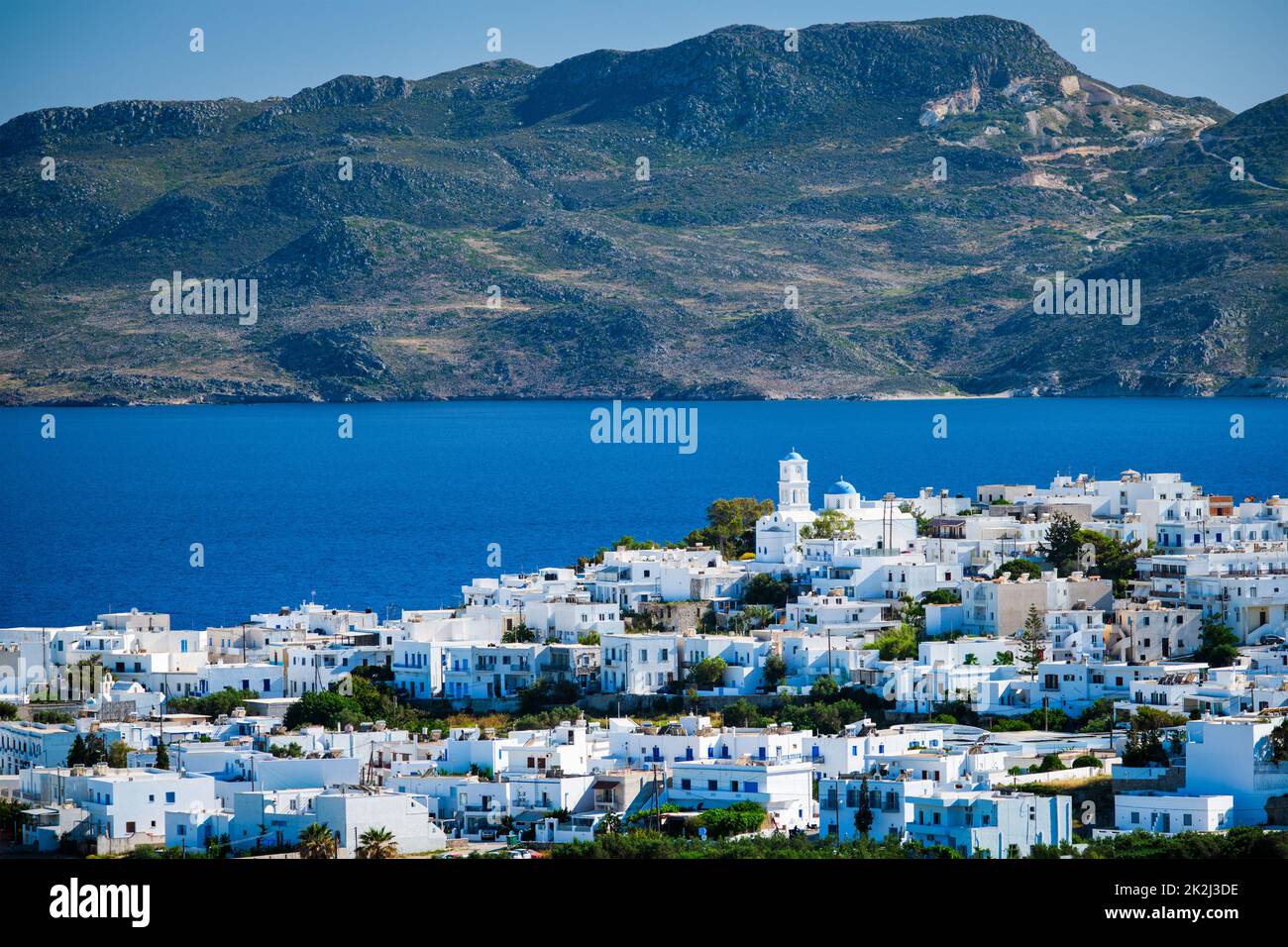 View of Plaka village with traditional Greek church. Milos island ...