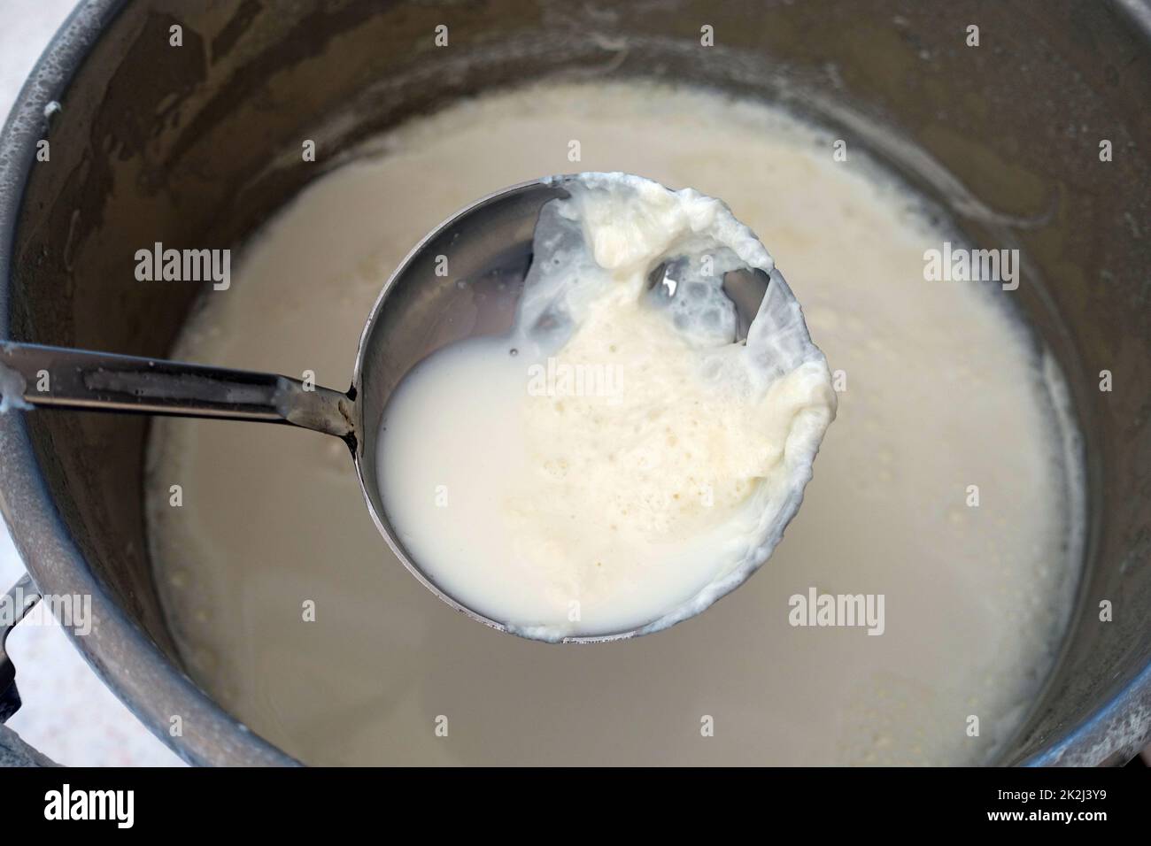 Fat milk cream on cooked milk, which is formed on natural cow's milk ...