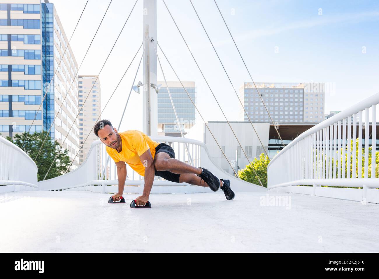 Black hispanic sportsman training outdoors in the city - African man ...
