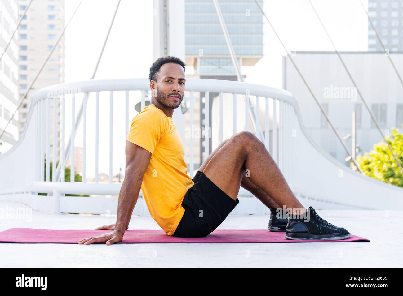Black hispanic sportsman training outdoors in the city - African man ...