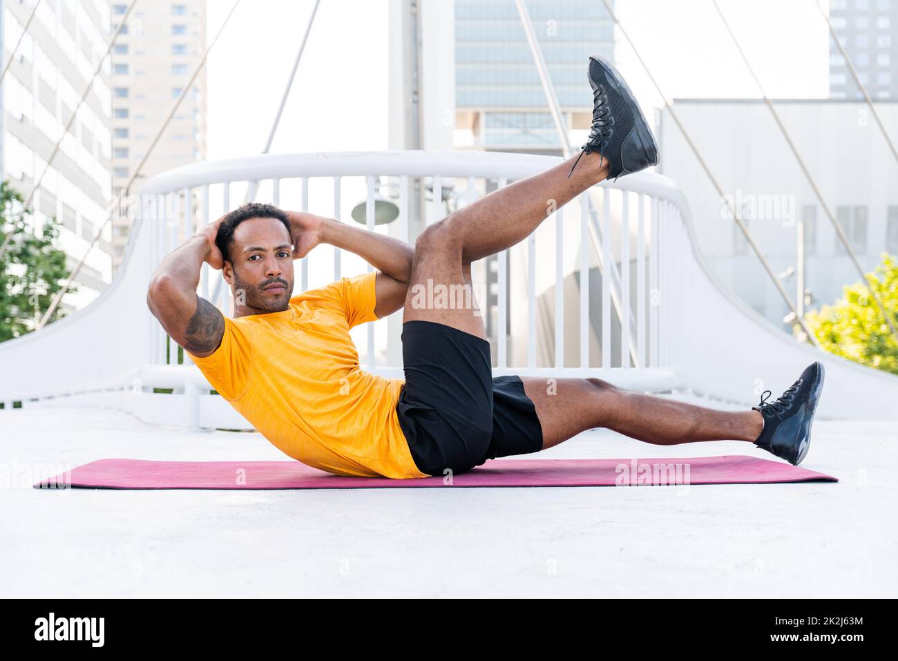 Black hispanic sportsman training outdoors in the city - African man ...