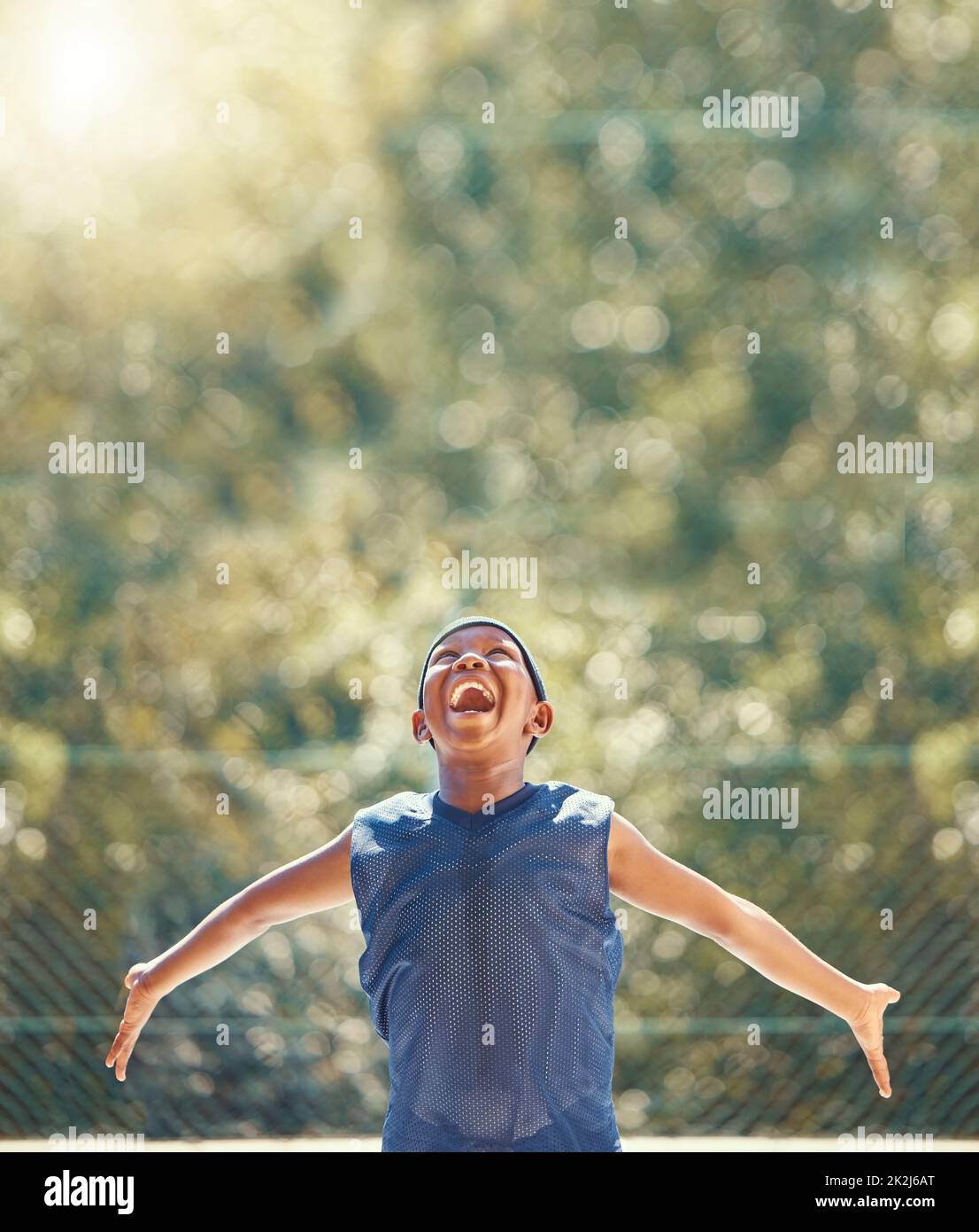 Happy, excited and shouting basketball child with a smile outdoor on ...