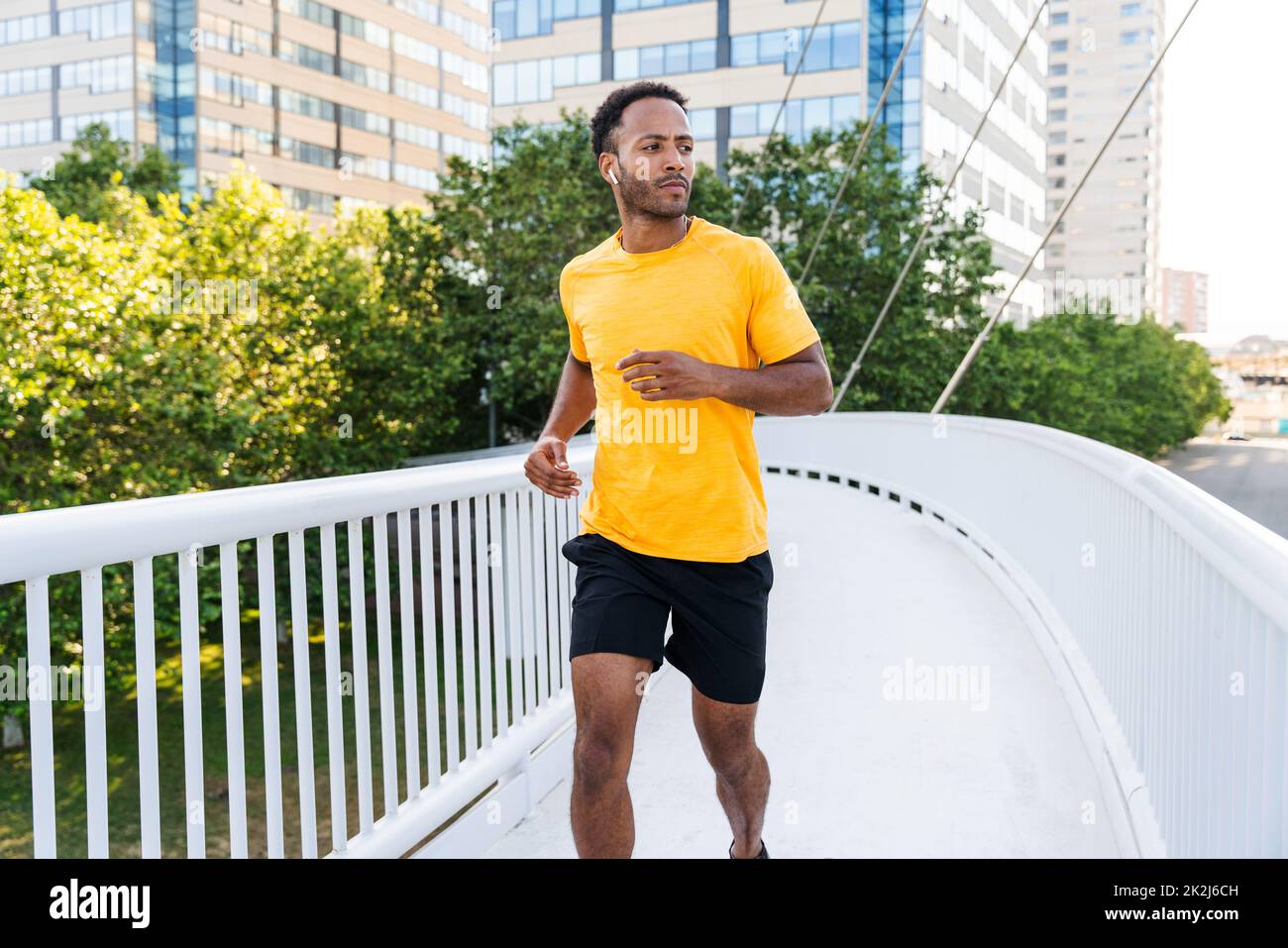 Black hispanic sportsman training outdoors in the city - African man ...
